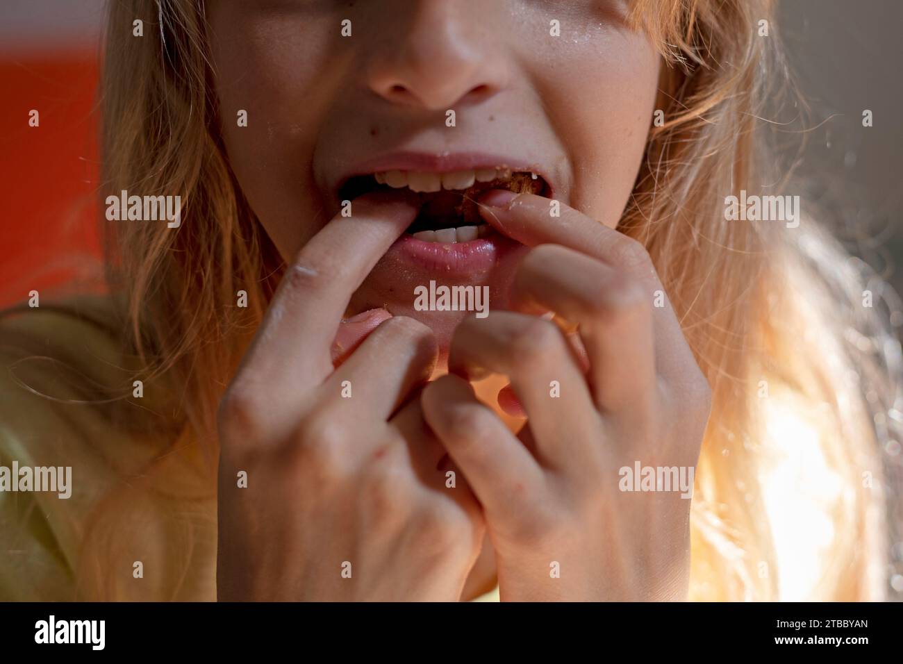 girl eats croissant stuffing it into her mouth Stock Photo - Alamy