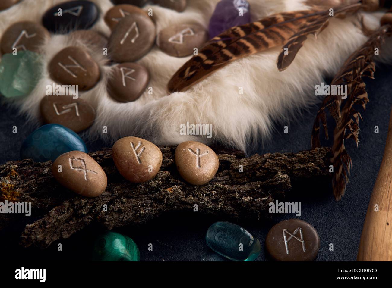 handmade stone runes on white fur Stock Photo - Alamy
