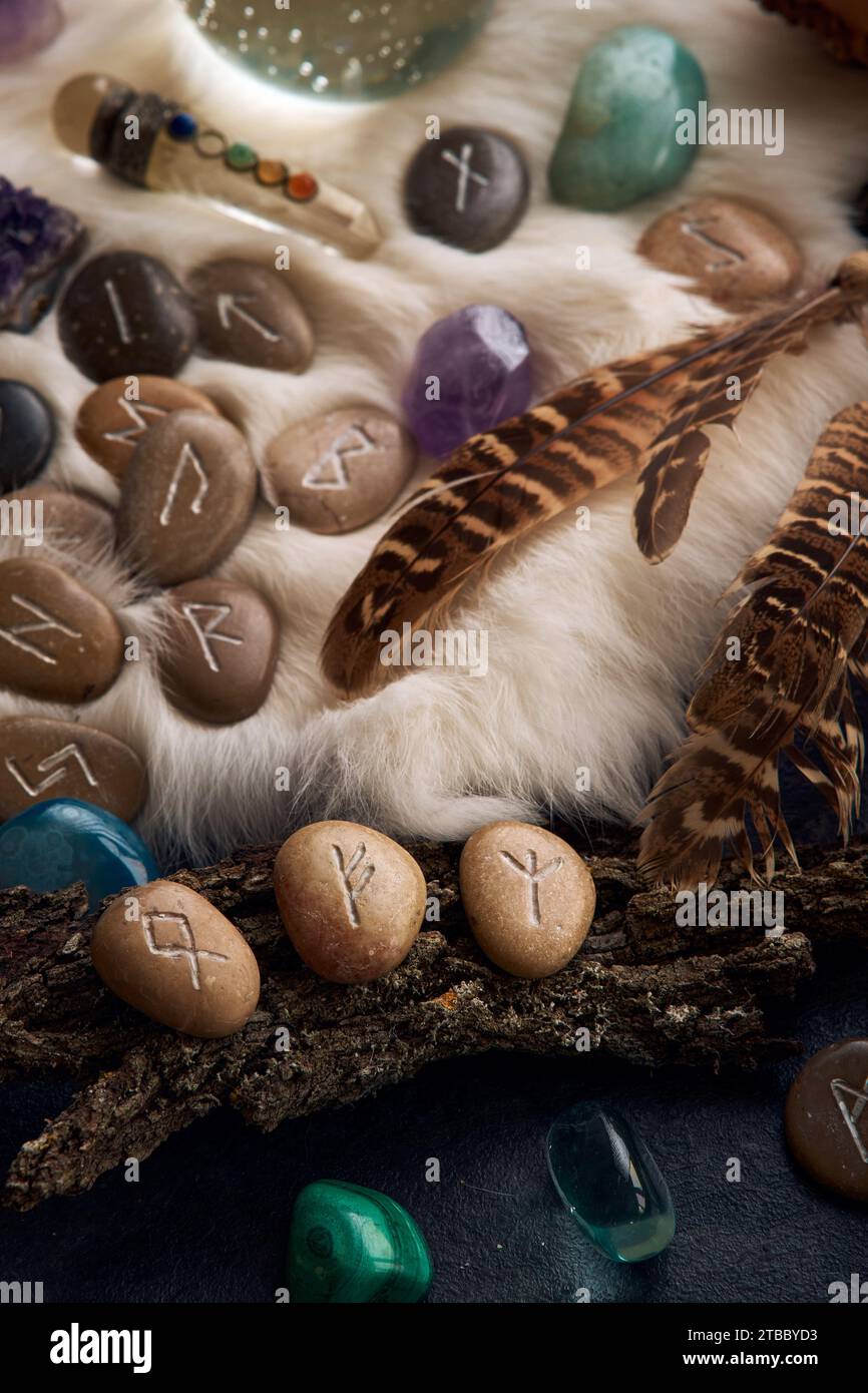 handmade stone runes on white fur Stock Photo - Alamy