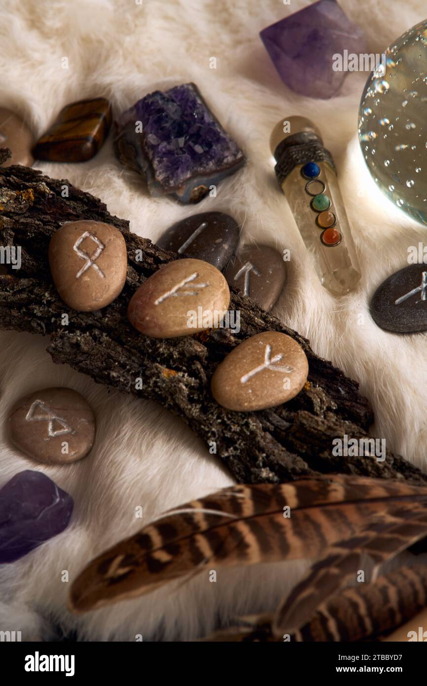 handmade stone runes on white fur Stock Photo - Alamy