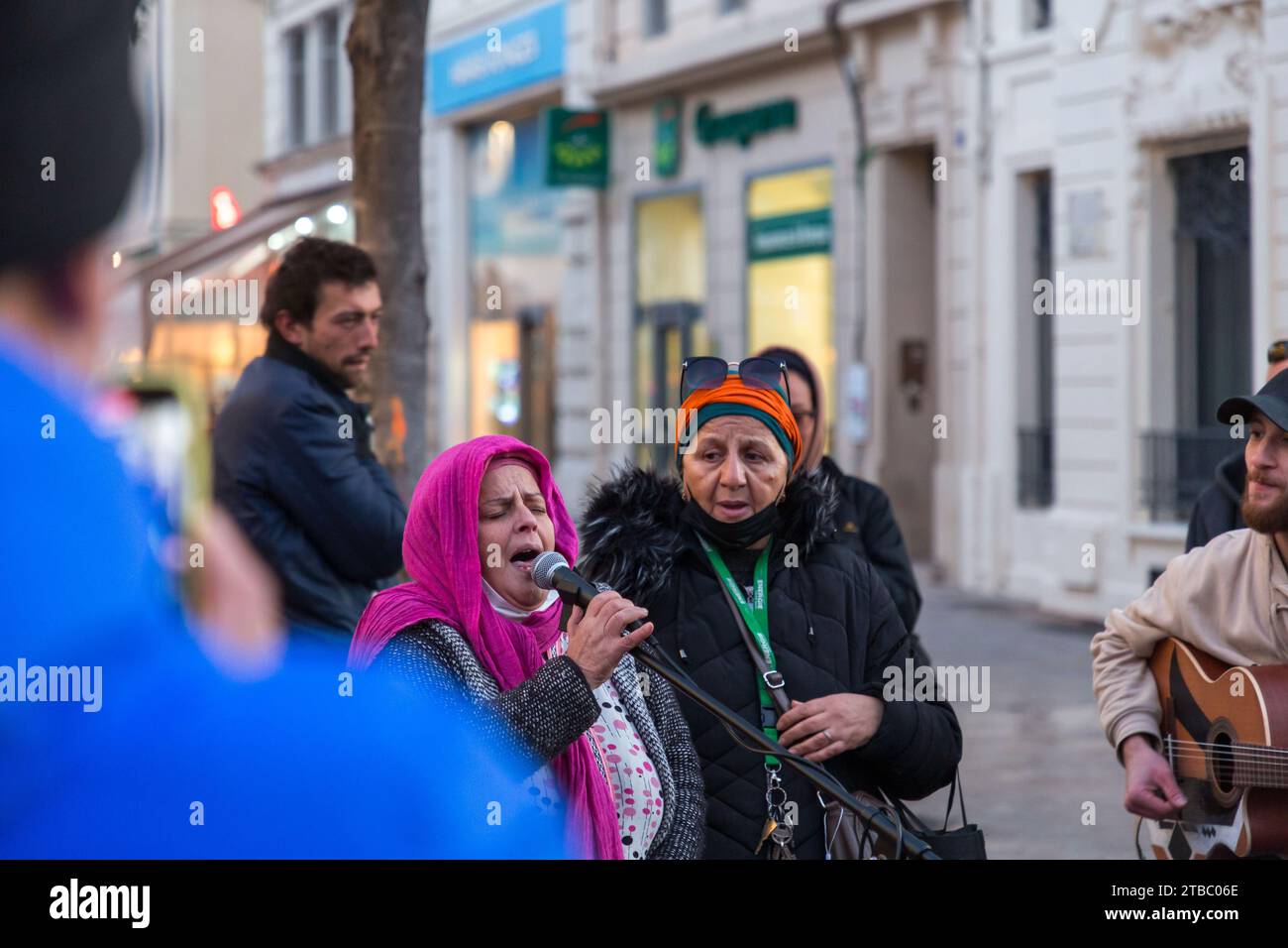 Marseille, France - January 28, 2022: Senior Arab lady singing in a ...