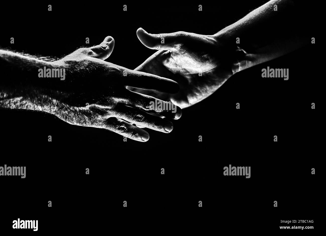 Handshake. Men holding hands isolated on black. Connection and human ...
