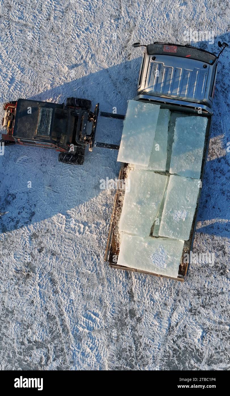 Aerial photo shows workers cutting ice lines to mine ice on Songhua ...