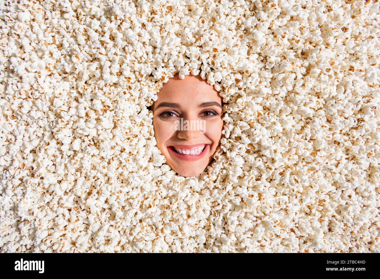 Photo Of Excited Cheerful Young Girl Head Curious Stick Out Looking Through Round Hole Covering