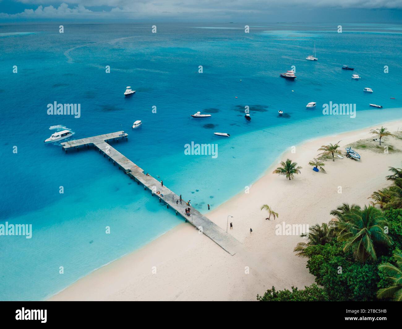 Aerial view of paradise Maldives tropical beach with pier and speed ...