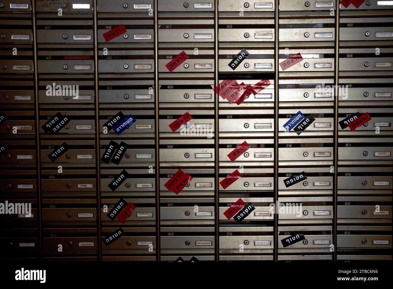 The mailroom in Kibbtz Nir Oz, where mailboxes are labeled with their ...