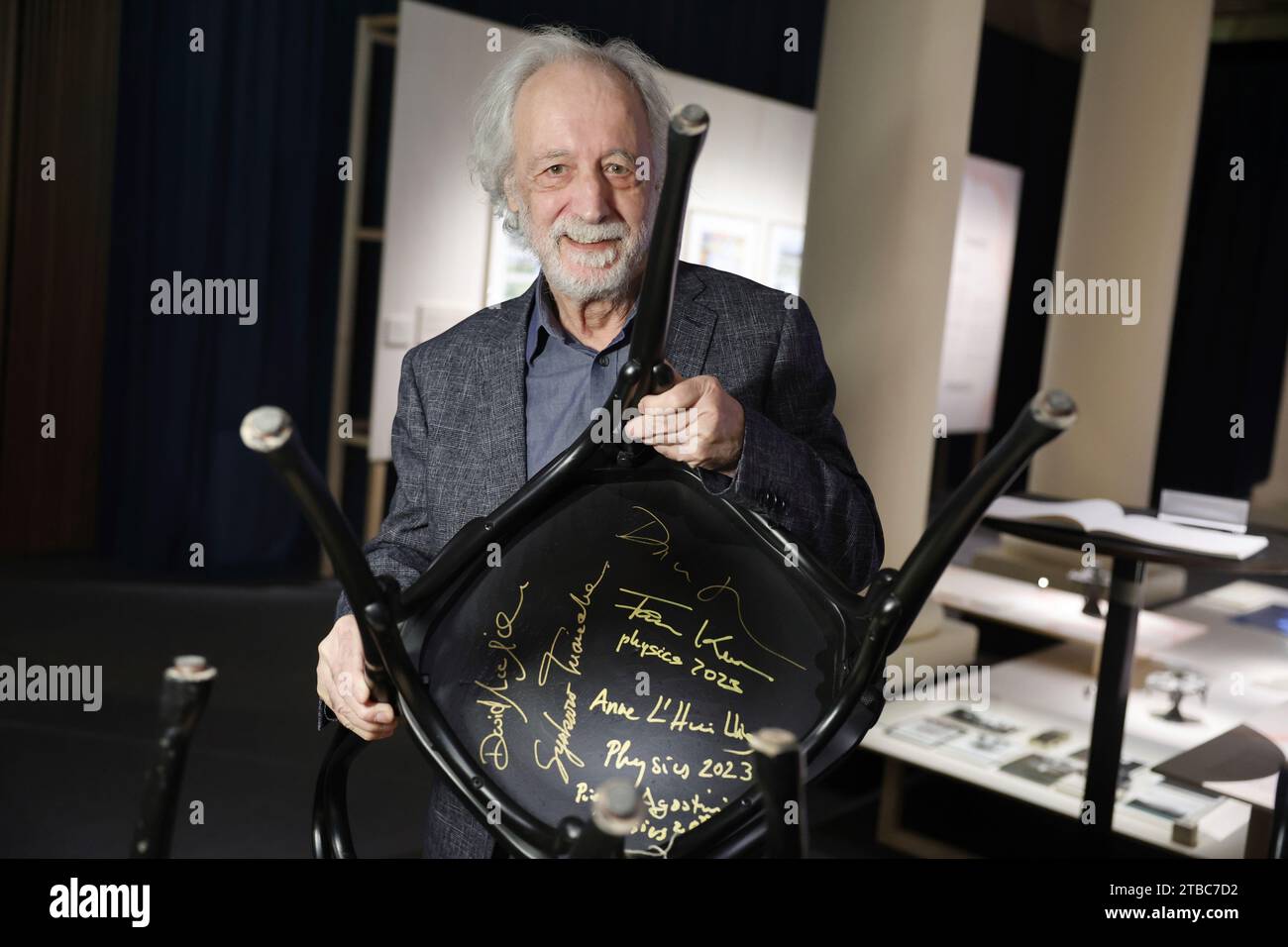 Pierre Agostini, Nobel Prize laureate in Physics, signs a chair at the ...
