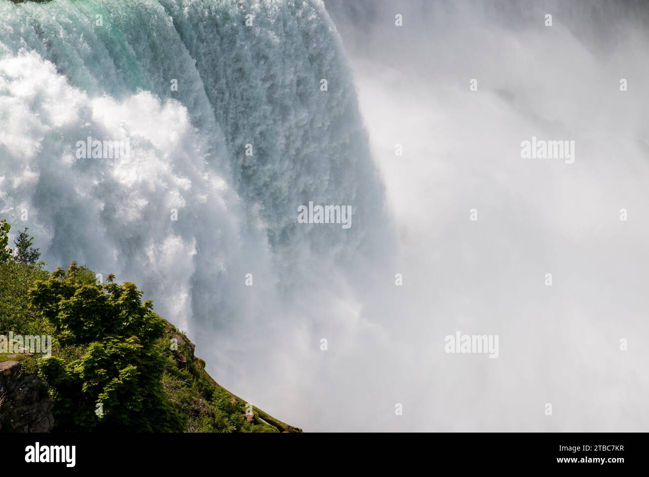 A large wall of water falling down a waterfall in Niagara Falls New ...