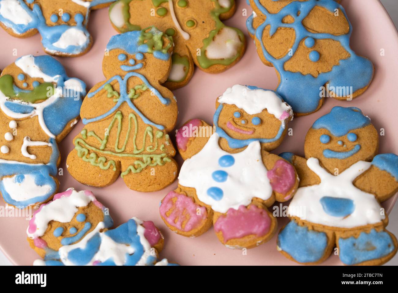 Christmas gingerbread in the shape of men decorated with colorful icing ...