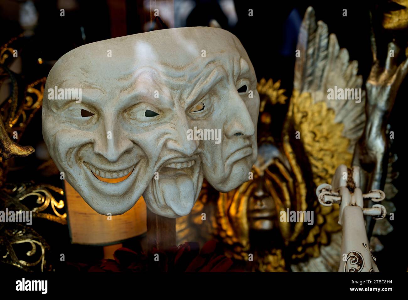 venetian mask expresses joy, irritation and sadness standing in a store ...