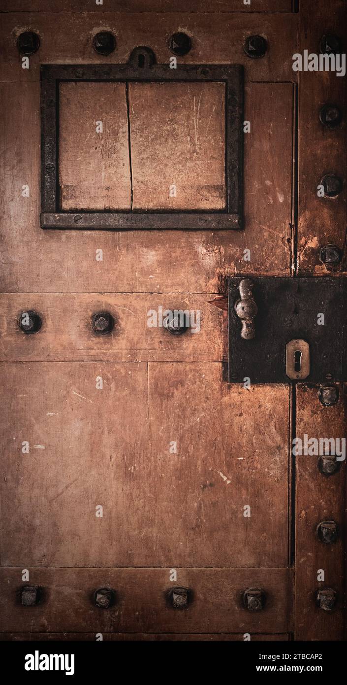 Vintage studded prison cell door in an English living history museum ...