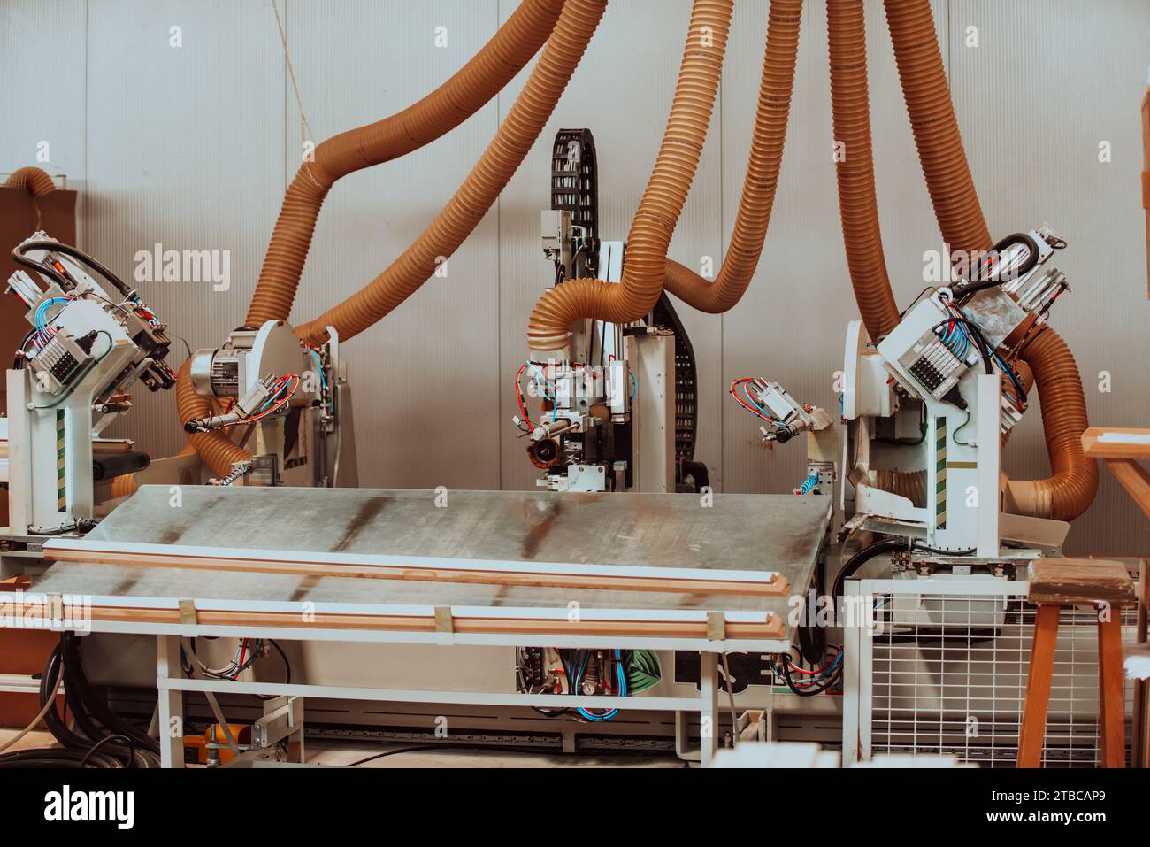 A state-of-the-art CNC machine in a modern wood processing facility ...