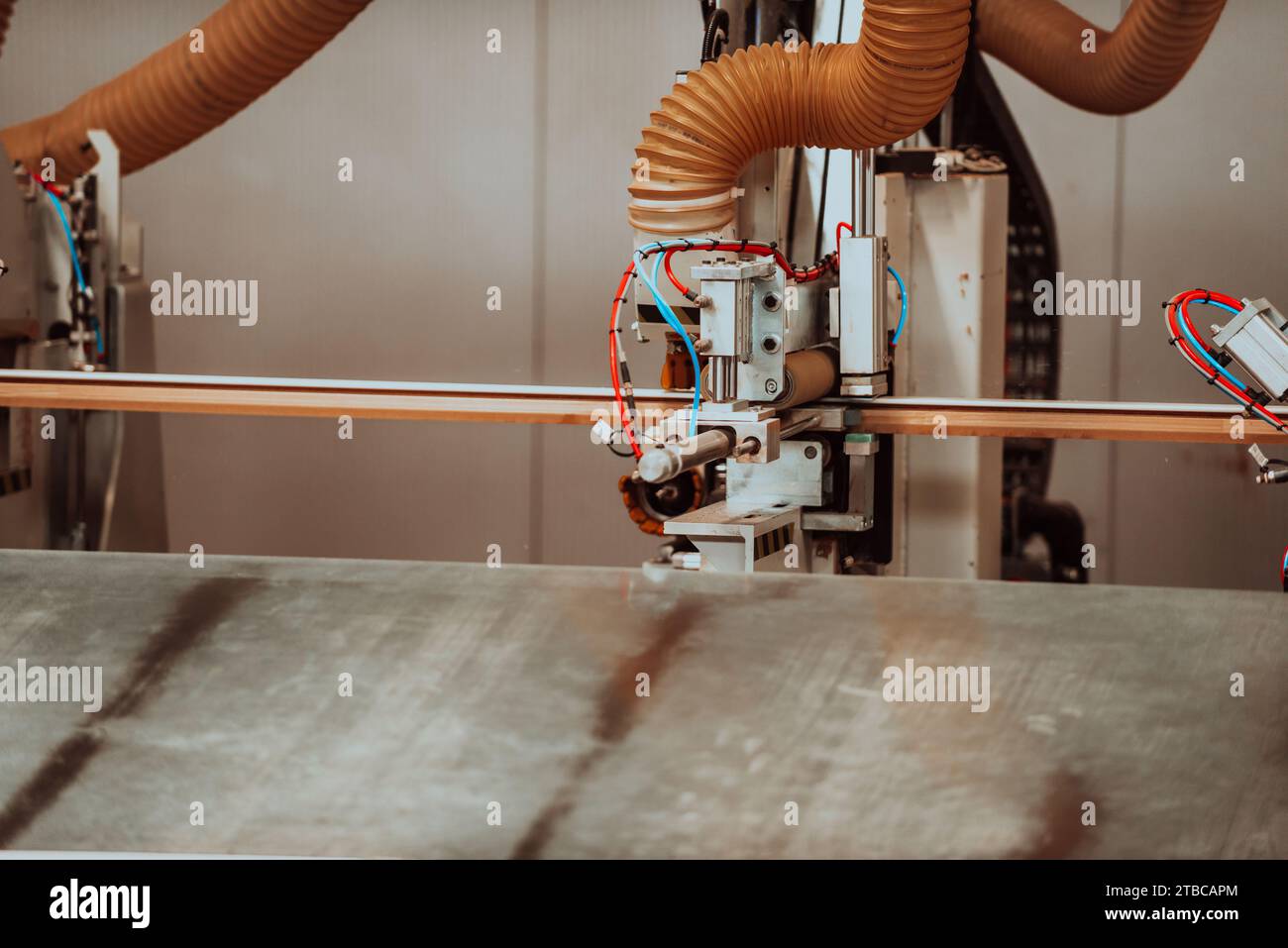 A state-of-the-art CNC machine in a modern wood processing facility ...