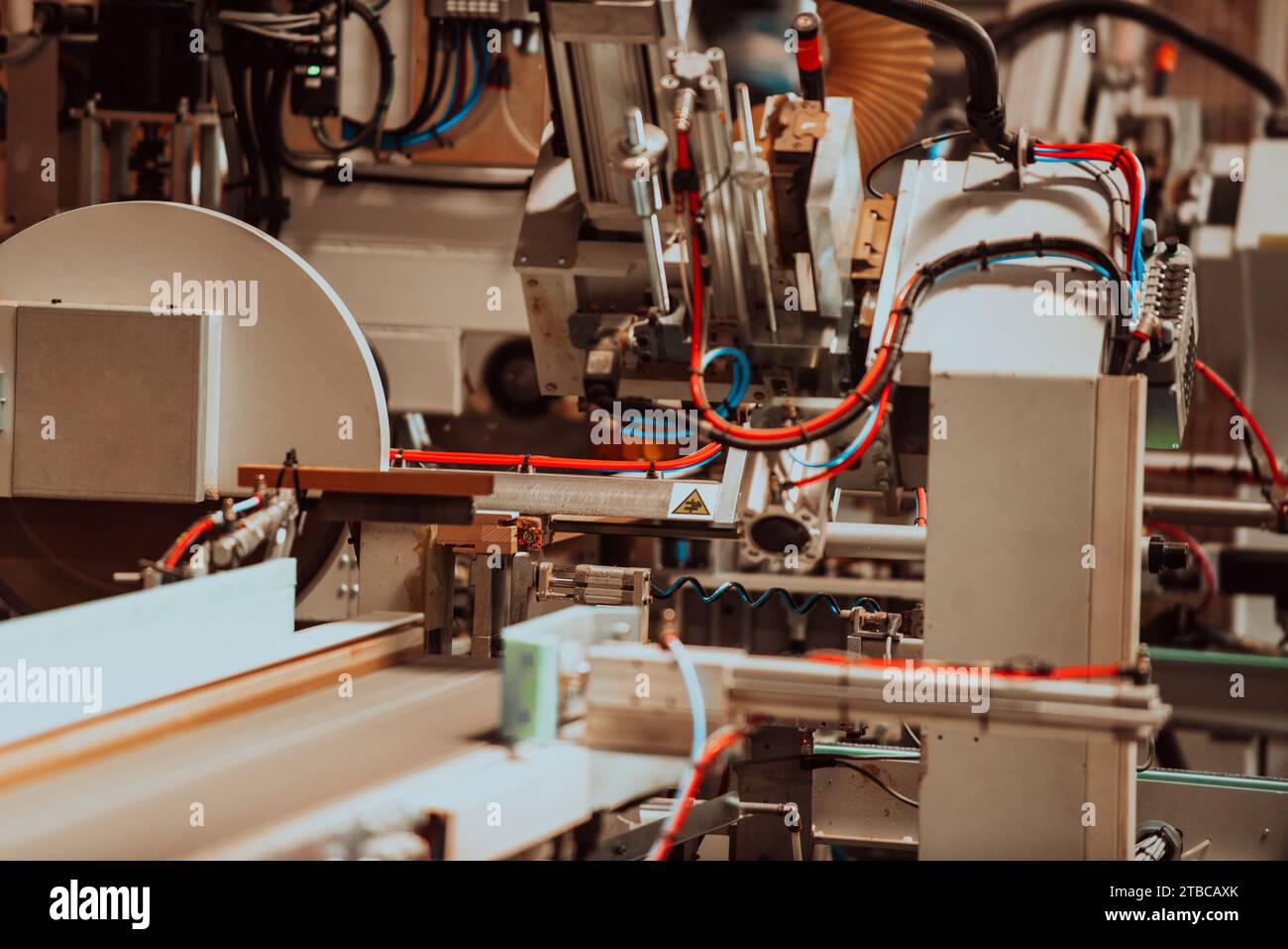 A state-of-the-art CNC machine in a modern wood processing facility ...