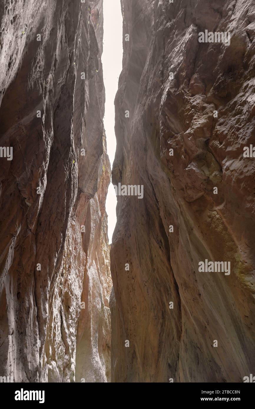 Narrow limestone gorge, towering walls, nature's sculpted beauty ...