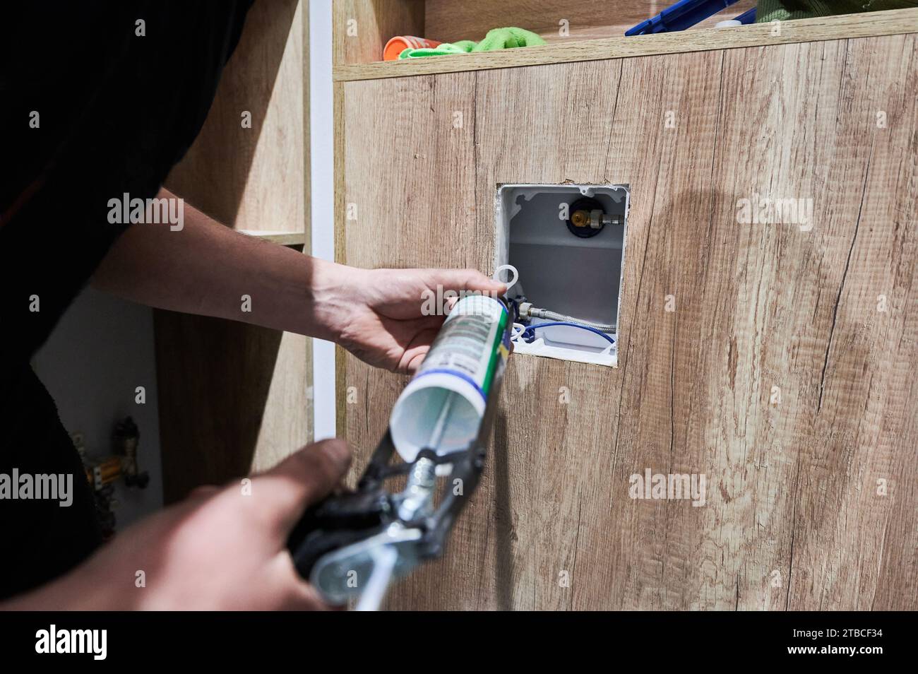 Close up plumber applying sealant hi-res stock photography and images ...