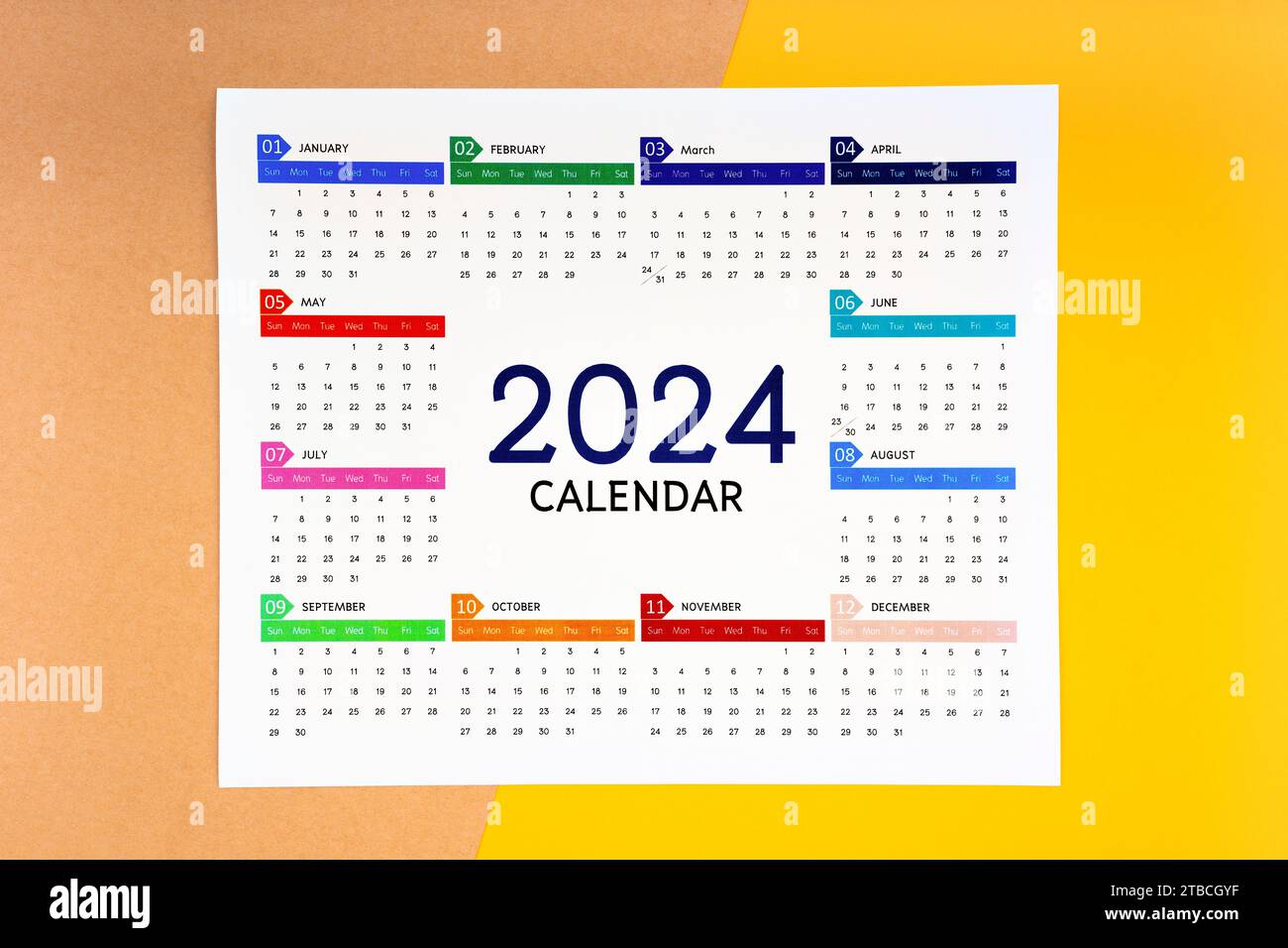 12 months desk calendar 2024 on brown and yellow color background Stock ...