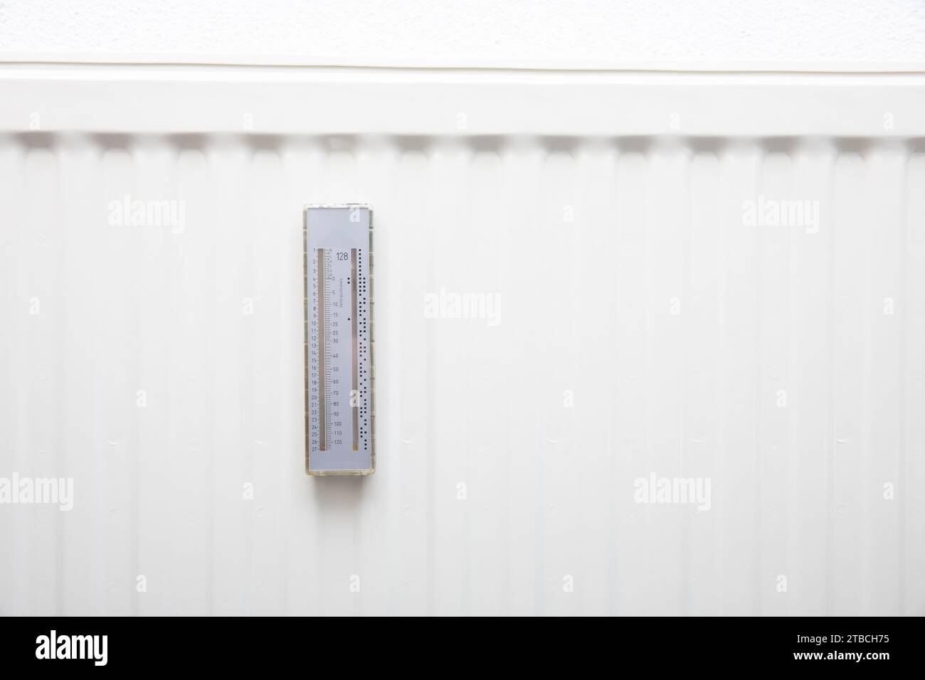 thermometer on the radiator, close-up, white background Stock Photo - Alamy