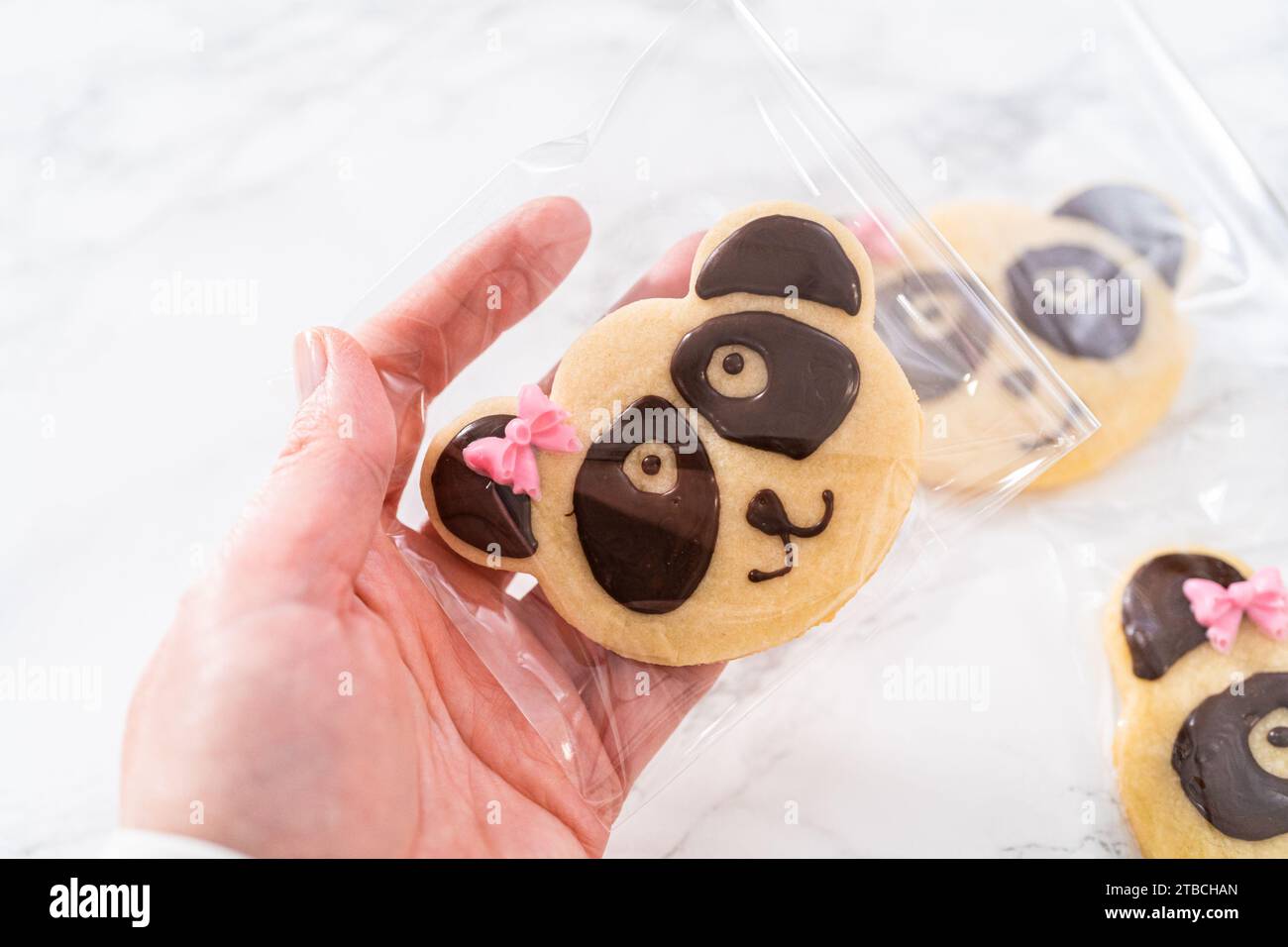 Panda shaped shortbread cookies with chocolate icing Stock Photo - Alamy