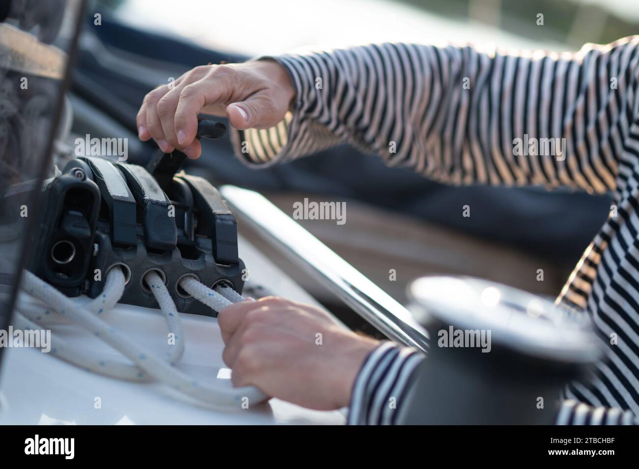 Close up picture of mans hands fixing a rope Stock Photo - Alamy