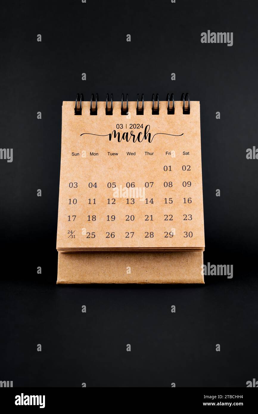 2024 March brown desk calendar on black background Stock Photo - Alamy