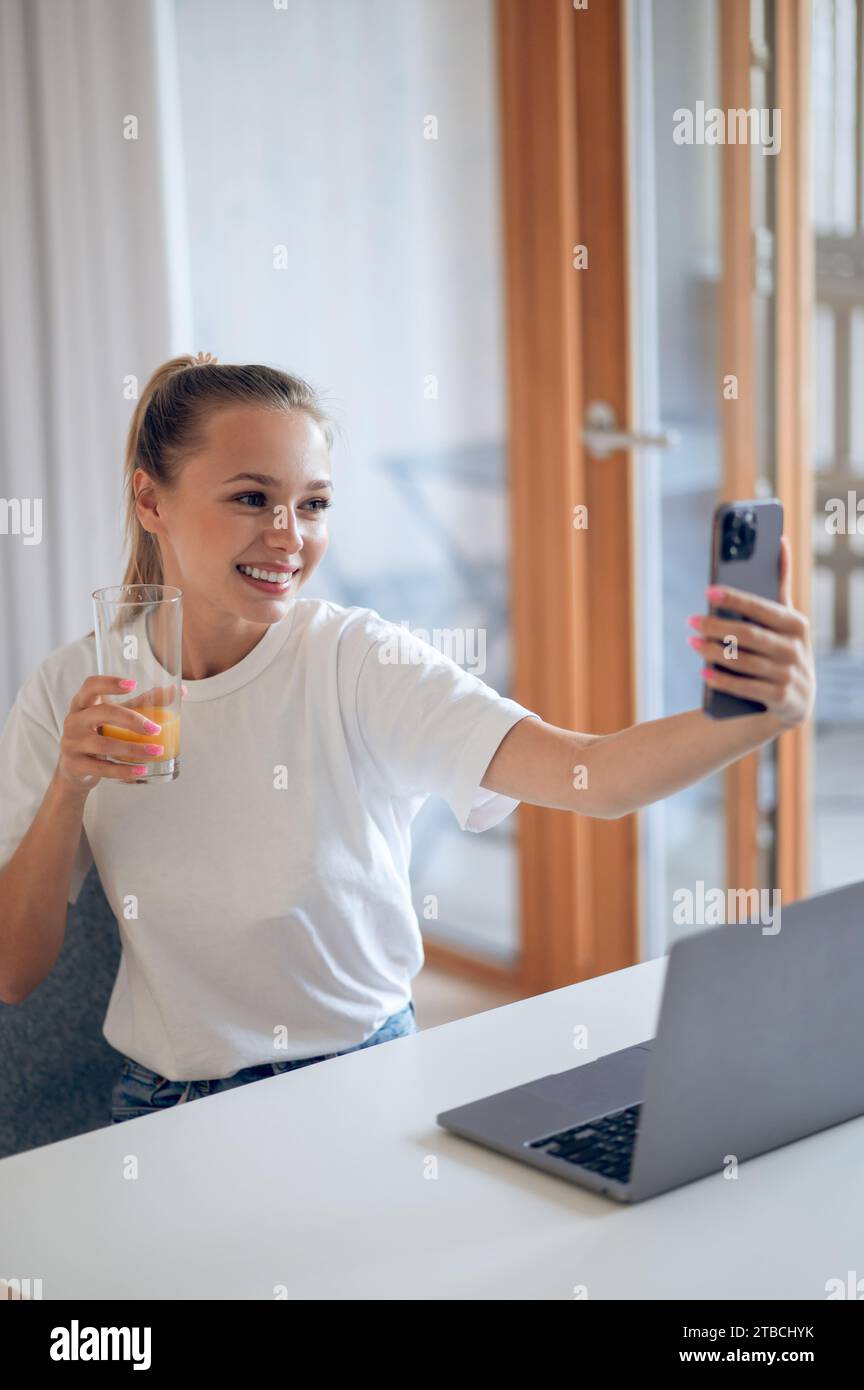 Cute smiling girl making selfie Stock Photo - Alamy