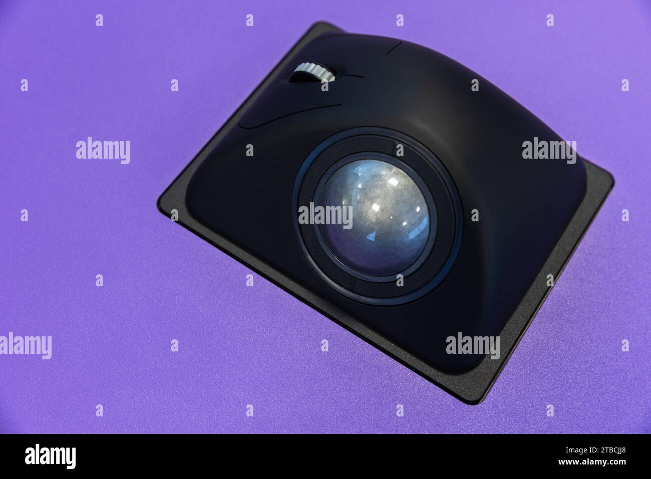 Built-in tabletop input device, black trackball mouse, a pointing ... Built-in tabletop input device, black trackball mouse, a pointing ...