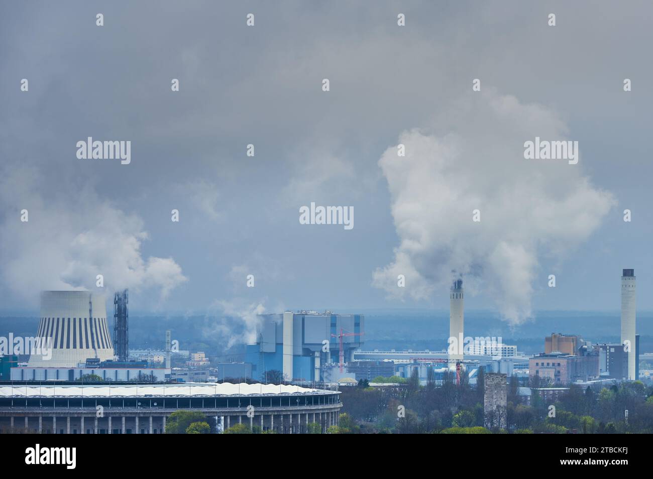 Smoking chimneys on a gloomy day with a pall of smoke rising from a ...