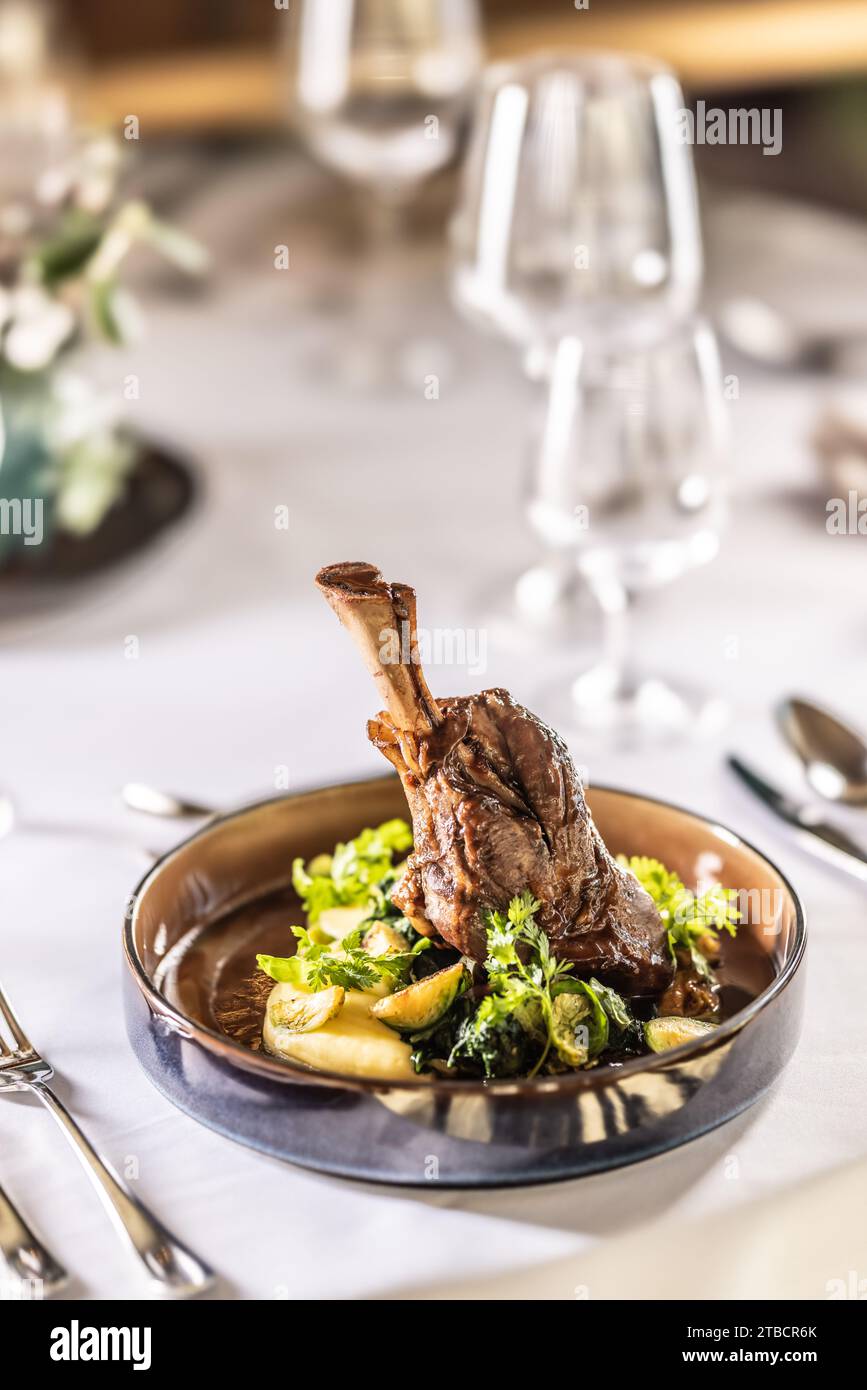 Confit leg of lamb on mashed potatoes with creamy kale, demi glace ...