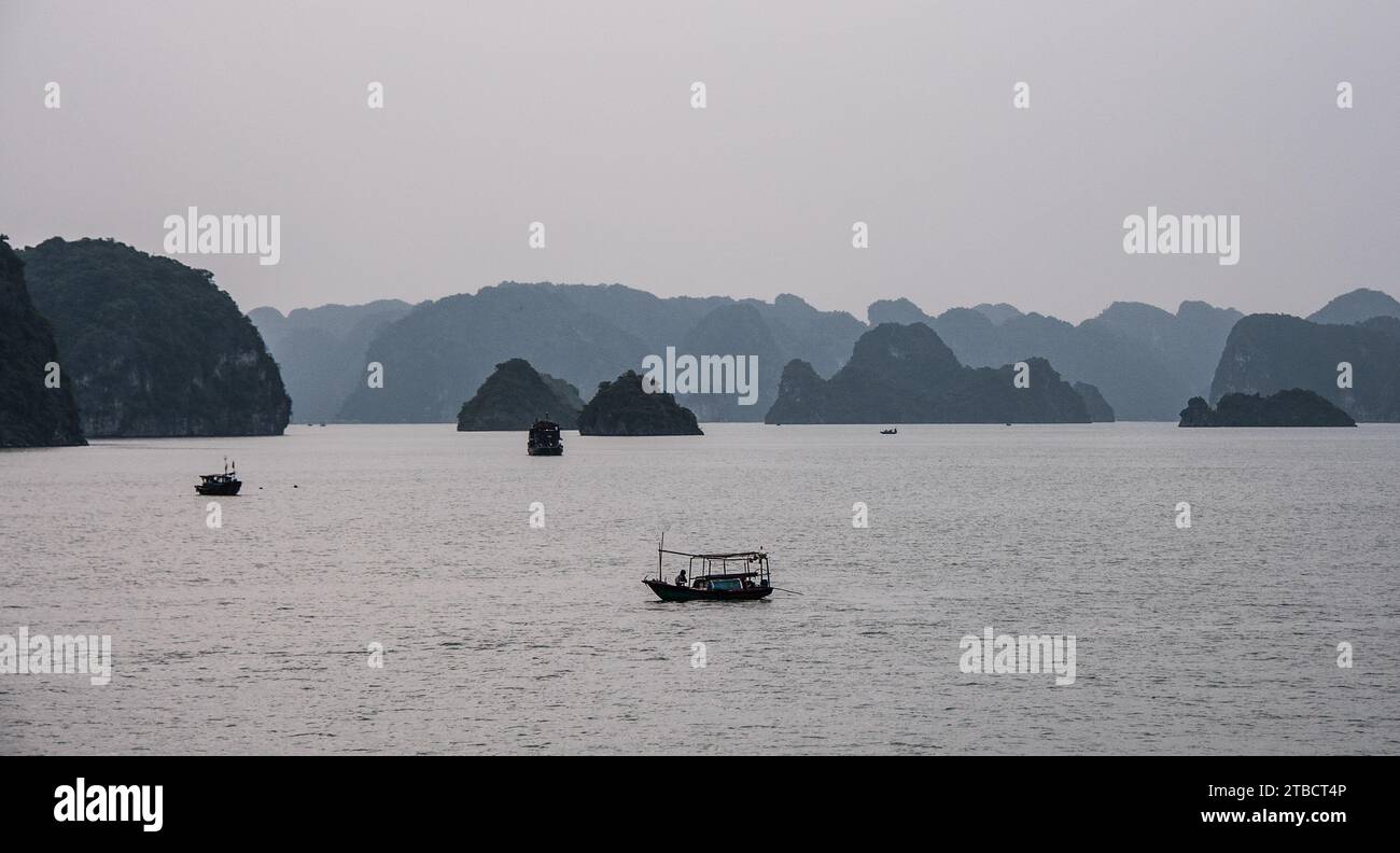 Panoramic early evening view of Halong Bay fishing boats Vietnam Stock ...
