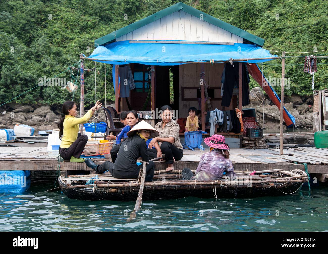 Waterworld family boat in Ha Long Bay moored outside a floating house ...