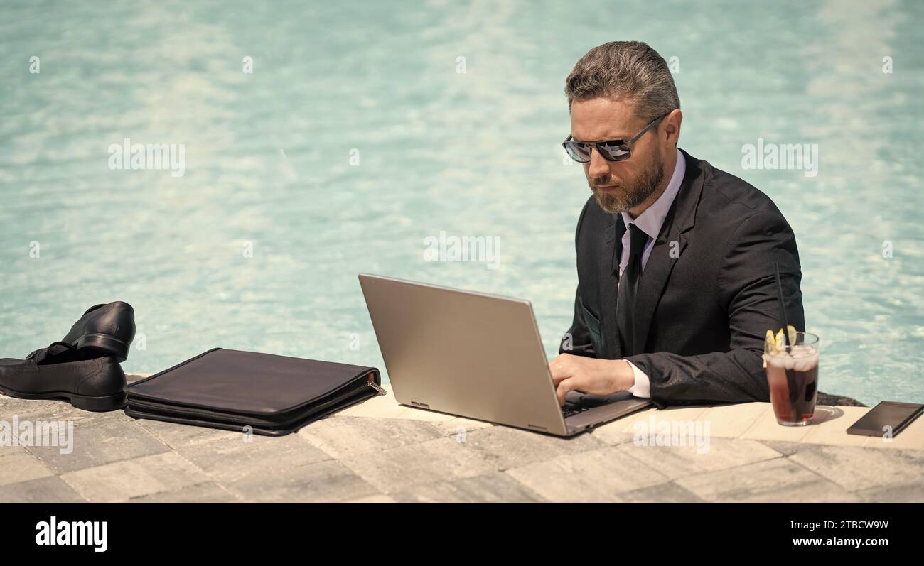 business man working remote in swimming pool, banner. business man ...