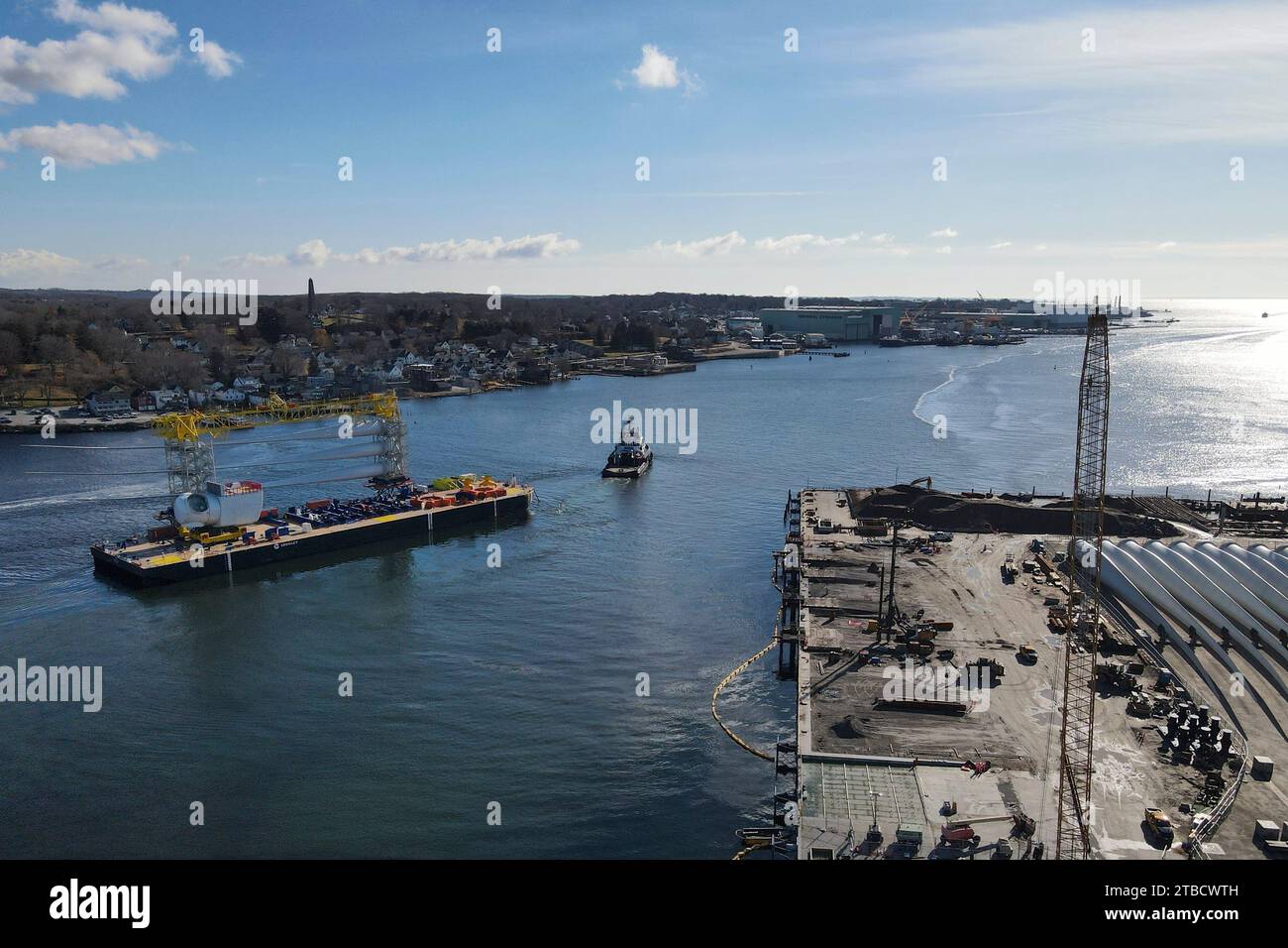 A generator and its blades are tugged at sea leaving State Pier in New ...