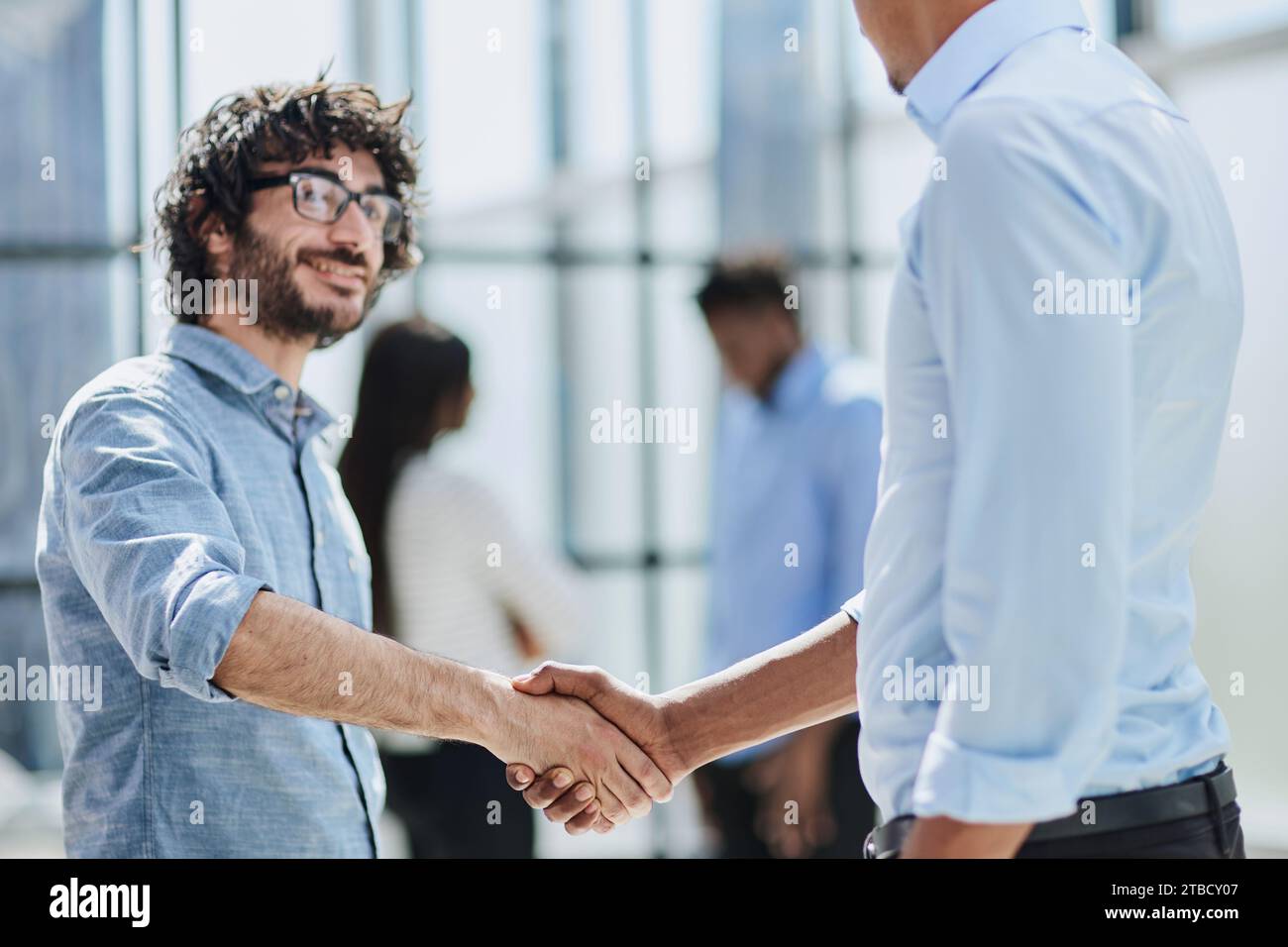 Successful Business Collaboration: Executives Greet with Handshake in ...