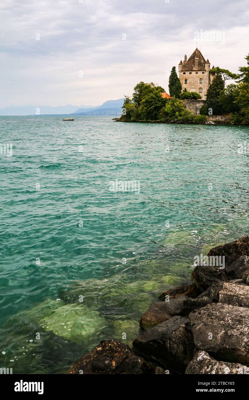 On the shores of lake Geneva, the castle of Yvoire, a medieval village ...