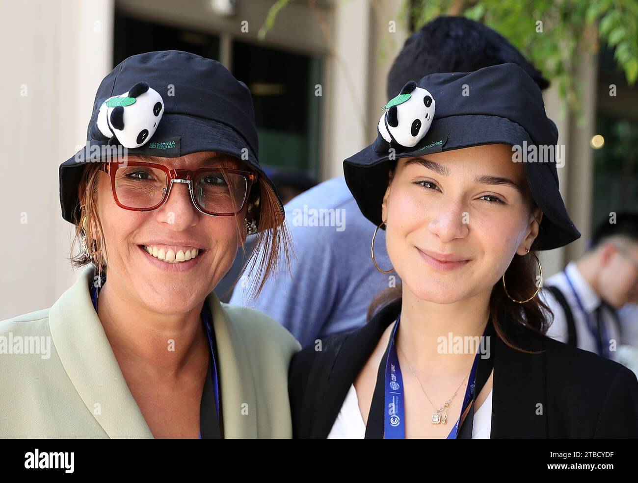 Dubai, UAE. 06th Dec, 2023. Attendees wearing panda-decorated hats pose ...