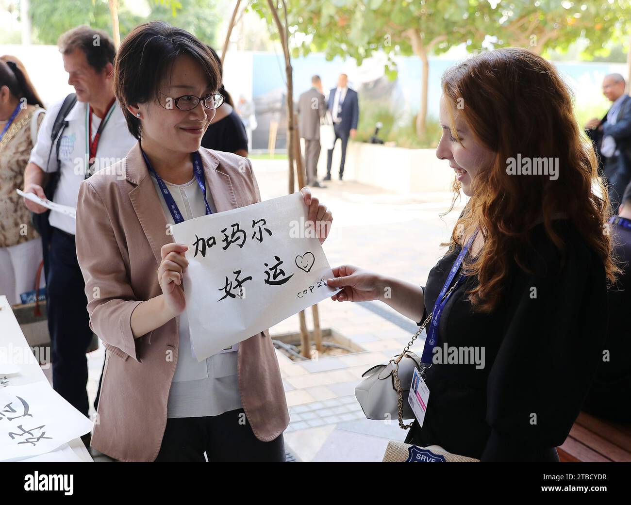 Dubai, UAE. 06th Dec, 2023. A staff member demonstrates Chinese ...