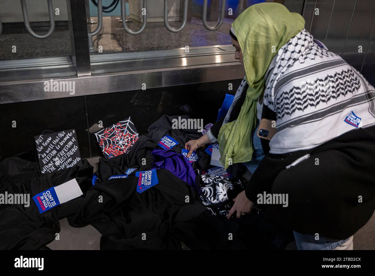 NEW YORK, NEW YORK - DECEMBER 5: A protester leaves stickers next to ...