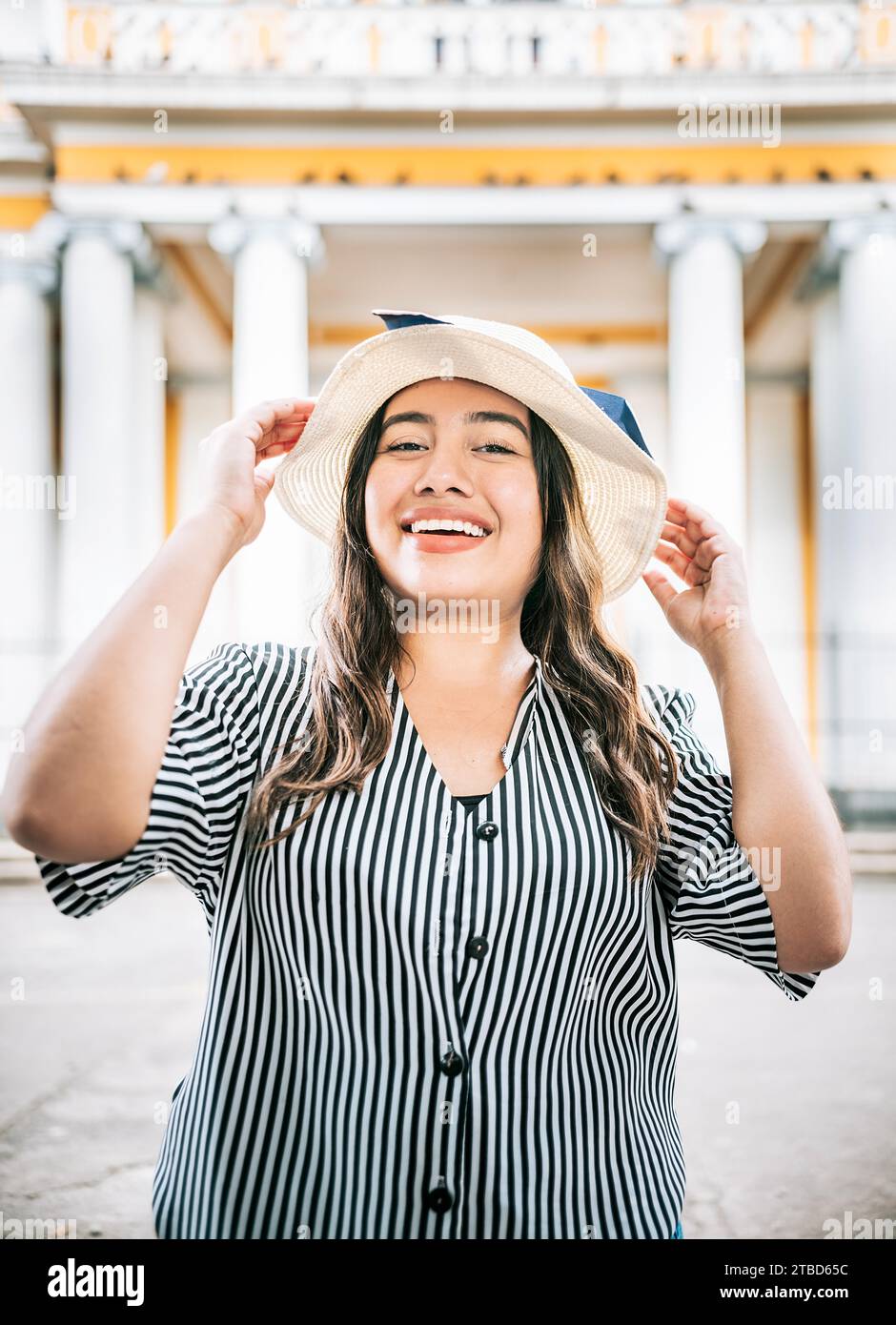 Portrait of smiling woman traveler in a tourist square. Portrait of a ...