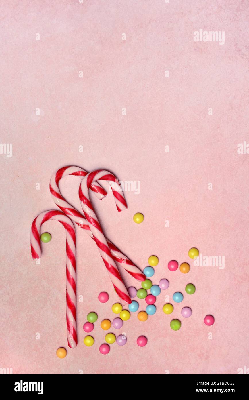 Candy canes and chocolate lentils Stock Photo - Alamy