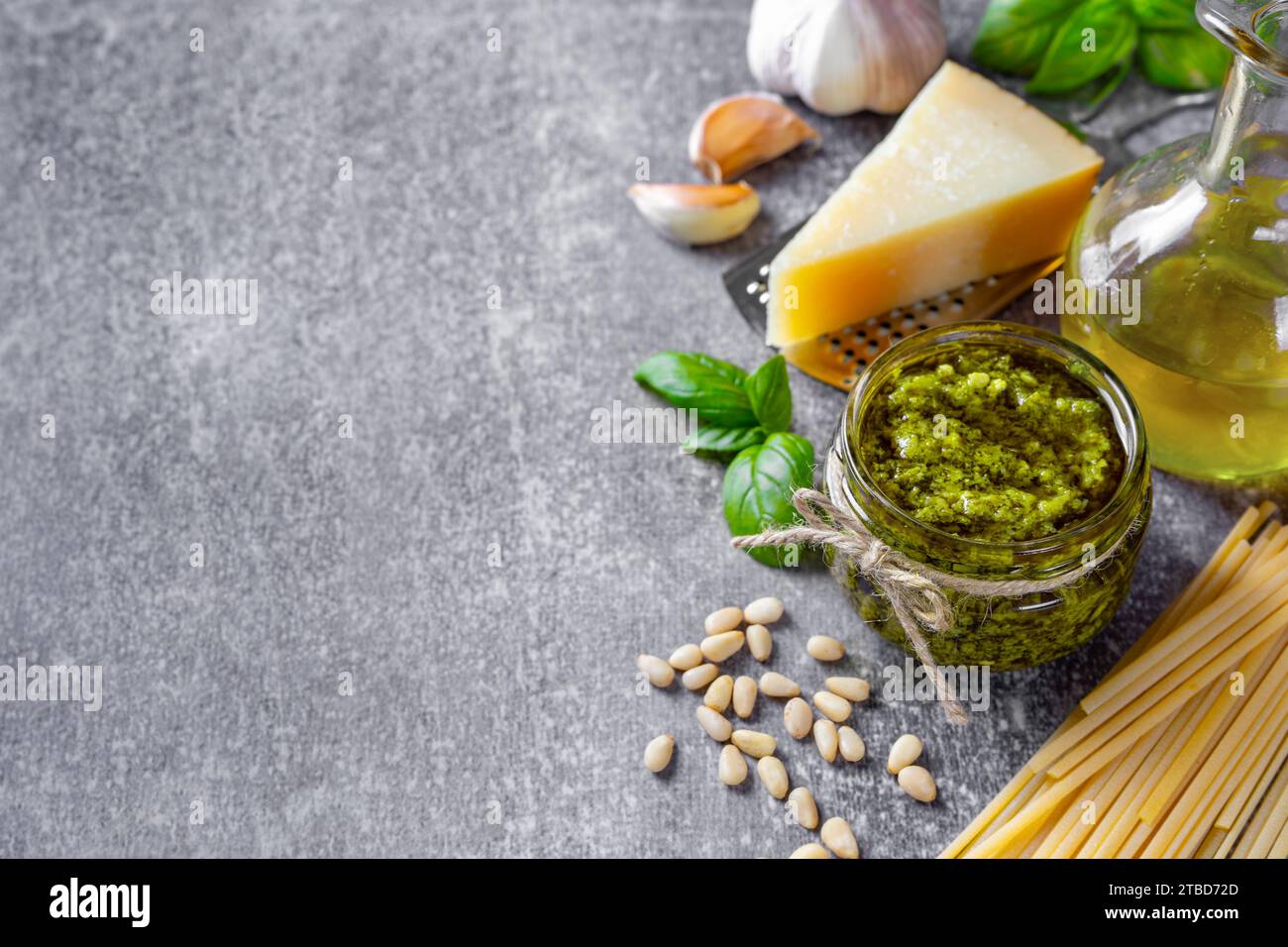 Homemade pesto sauce in small glass jar and ingredients for pasta on ...