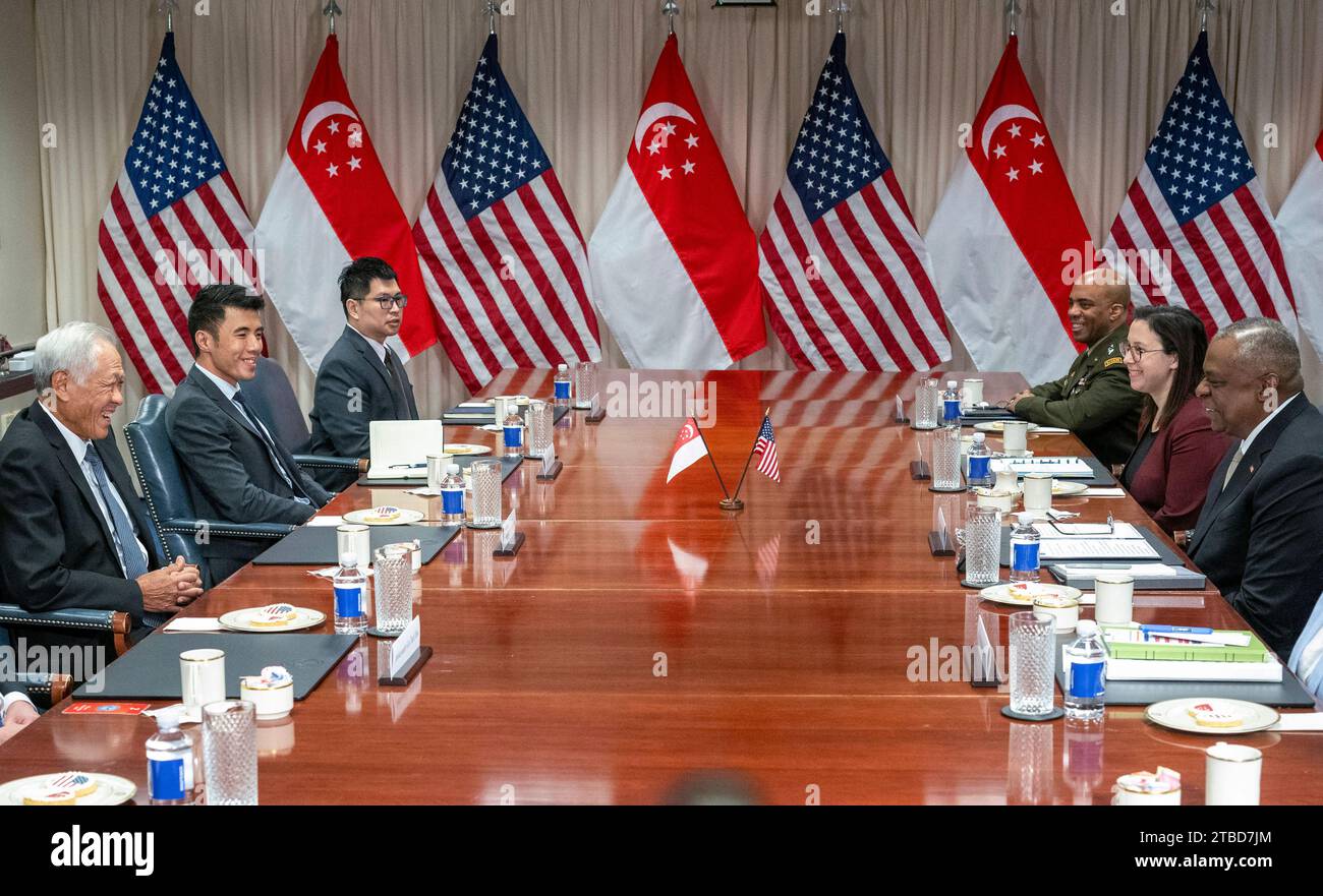 Defense Secretary Lloyd Austin, right, and Singapore's Defense Minister ...
