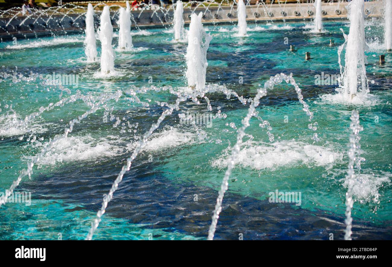The fountains gushing sparkling water in a pool in a park Stock Photo ...