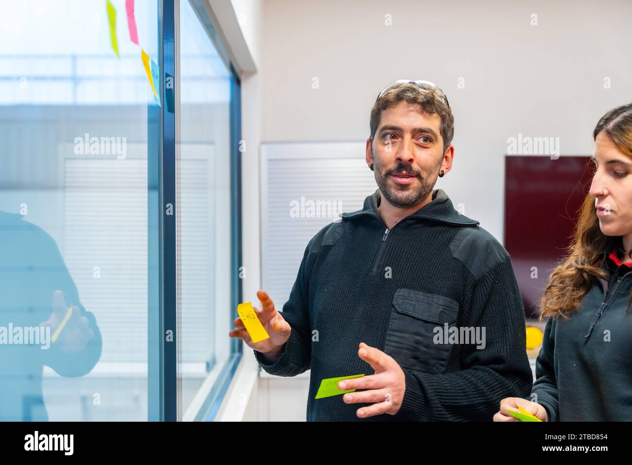 Cnc male engineer using adhesives notes during a brainstorming in the ...