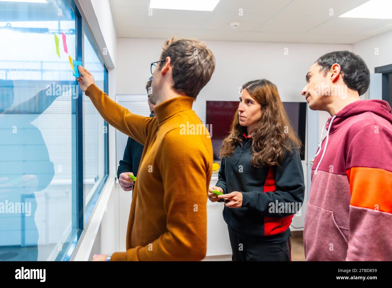 Cnc engineers work team using notes during a brainstorming in a work ...