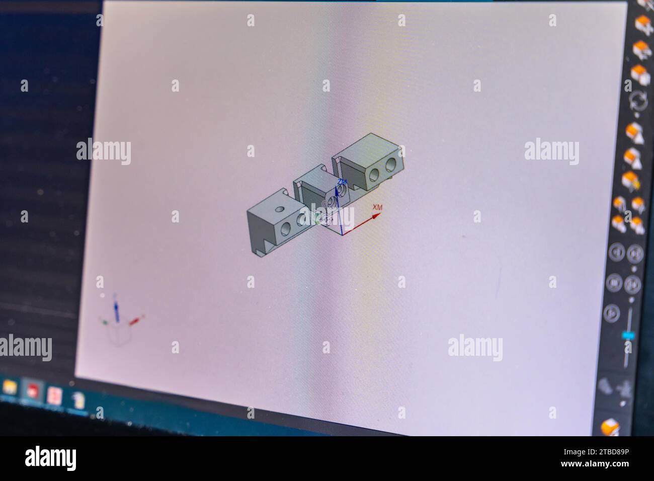 Computer screen with a model of metal piece in a cnc modern factory ...