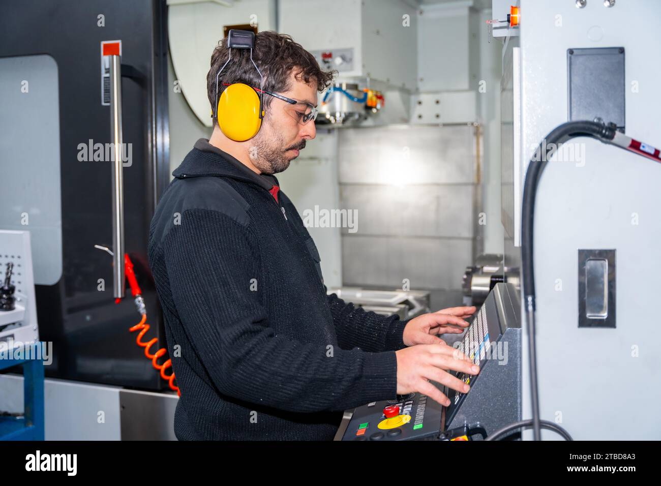 Young female factory worker hi-res stock photography and images - Alamy