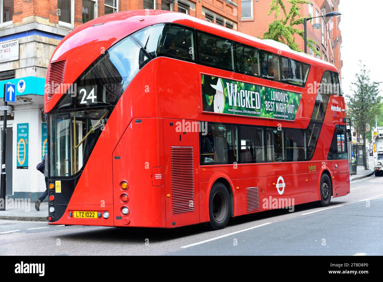 New double-decker bus with advertising in the City of London, London ...