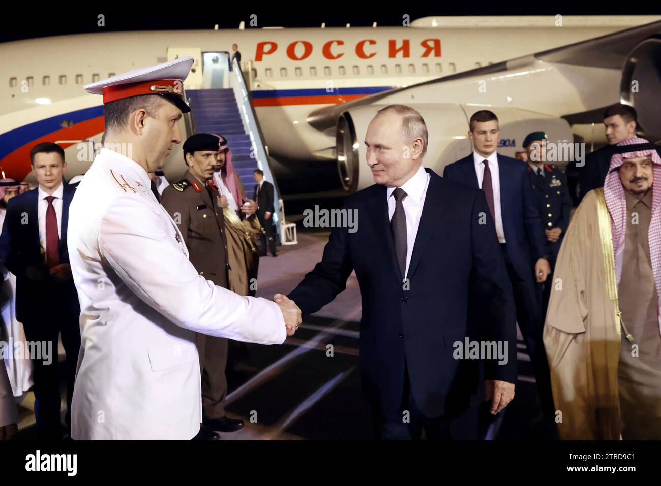 Russian President Vladimir Putin shakes hands with an officer upon his ...