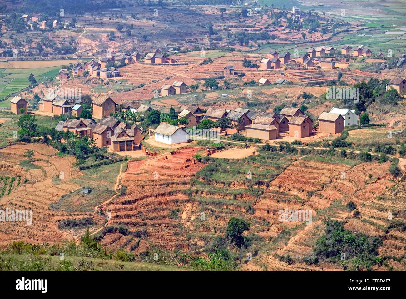 Terraced fields and two stories brick houses in Betsileo rural village ...